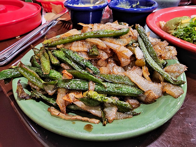 These aren't just sautéed vegetables—they're the supporting cast that makes the protein shine. Caramelized to perfection, they add sweetness and texture to every fajita bite.