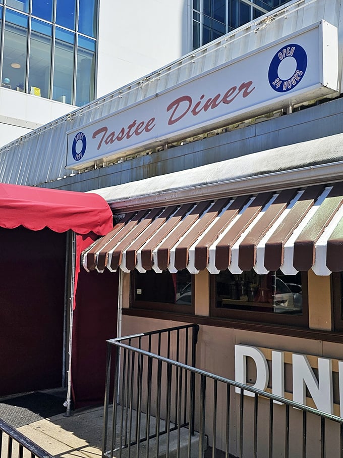 That neon-lit promise of "OPEN" beneath the Tastee Diner sign—six letters that spell "salvation" when you're hungry at impossible hours.