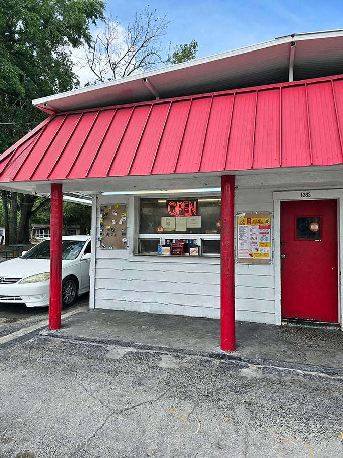 No-nonsense architecture that says, "We put our energy into the food, not the facade." The red pillars stand like sentinels guarding flavor treasures within.