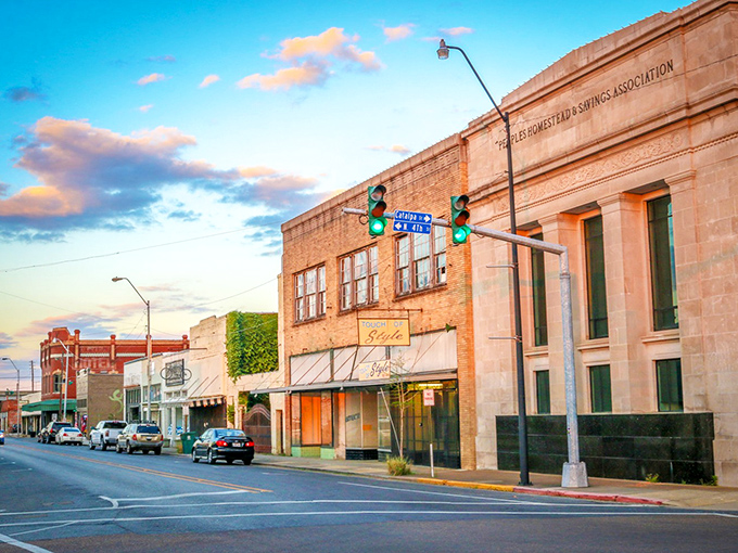 Historic downtown storefronts bask in golden hour light, their vintage facades housing modern businesses in a perfect marriage of past and present.