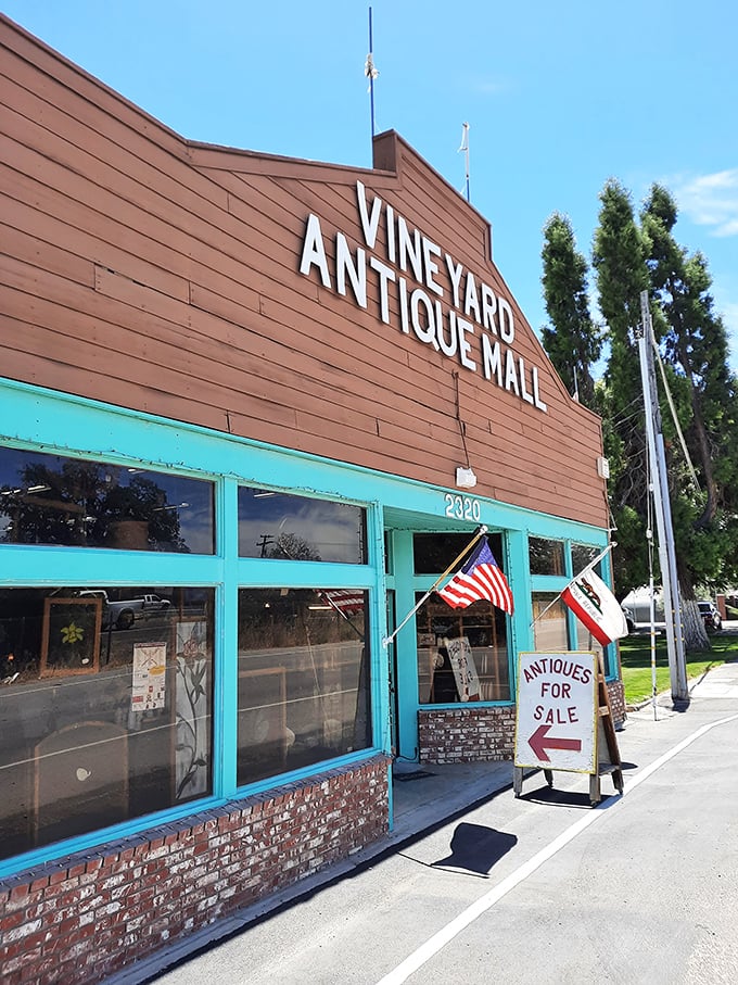 Vineyard Antique Mall's rustic exterior with bright turquoise accents – like a barn that swallowed a century of treasures.