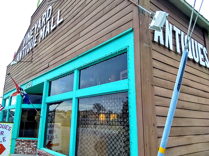 The weathered wood and bright trim of Vineyard Antique Mall – where wine country meets vintage country.