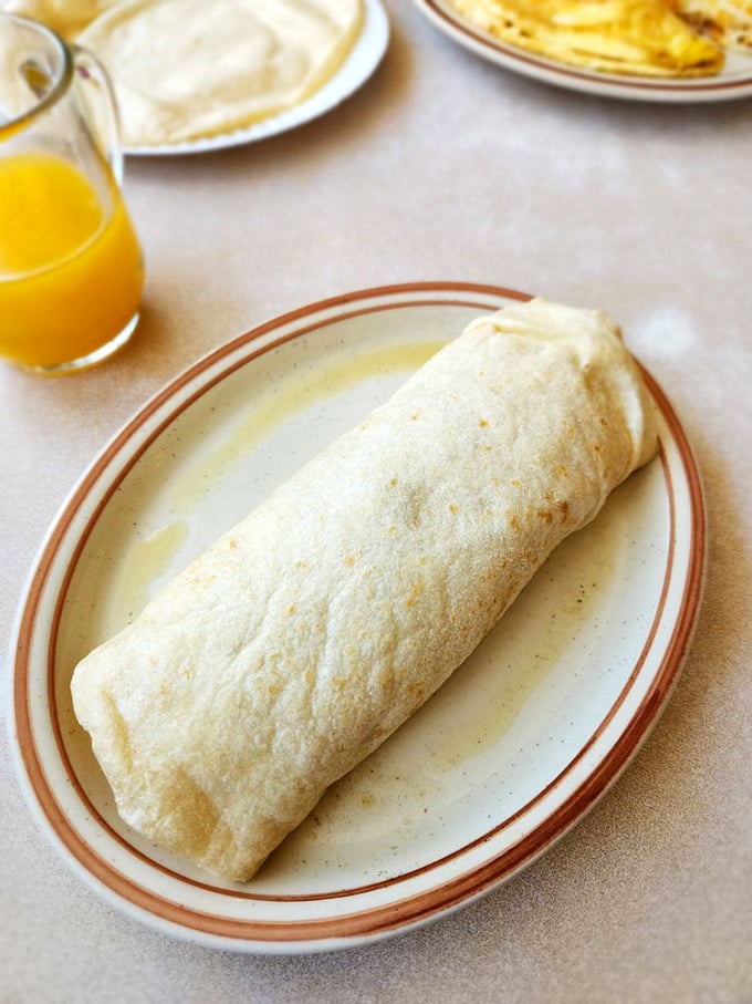 The breakfast burrito—New Mexico's gift to humanity—wrapped with the precision of a surgeon and the love of a grandmother.