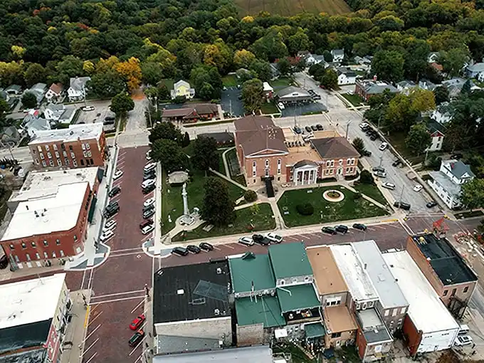 From above, Mount Carroll reveals its perfect proportions—a courthouse square surrounded by history, with rolling hills cradling it all in green embrace.
