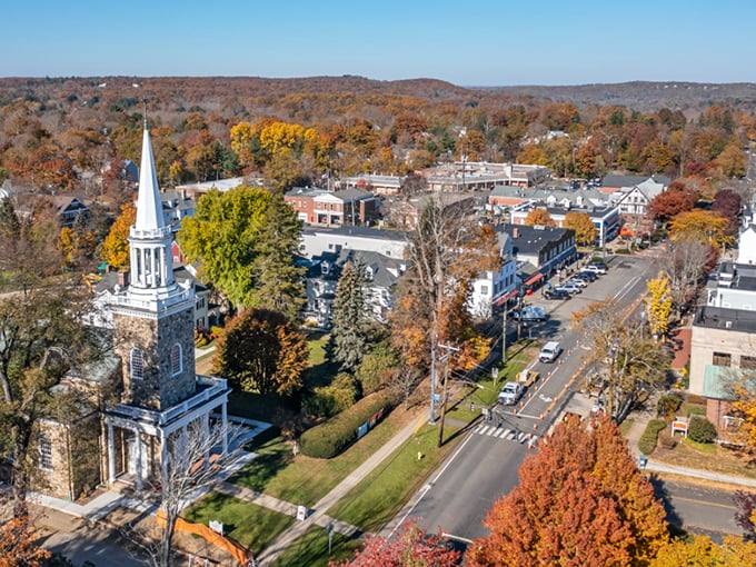 From above, Ridgefield reveals its perfect balance of nature and civilization—where church steeples and autumn foliage compete for who can be more photogenic.