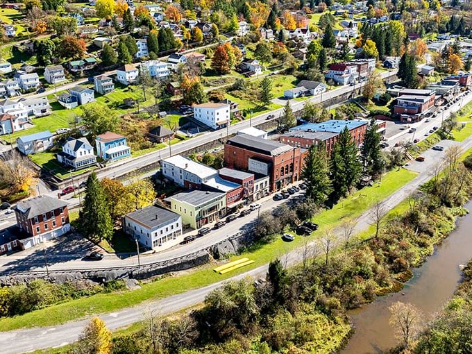 From above, Thomas reveals its perfect positioning – nestled between rolling hills and the river that once powered its industrial ambitions.