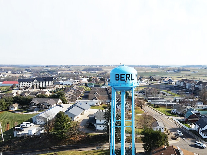 From above, Berlin's iconic blue water tower stands sentinel over a town that masterfully balances preservation of tradition with welcoming hospitality.