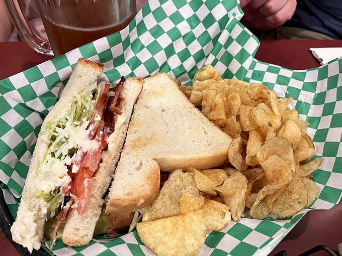 This isn't just a sandwich—it's architecture. Layers of BLT goodness alongside house-made kettle chips that crunch loud enough to turn heads.