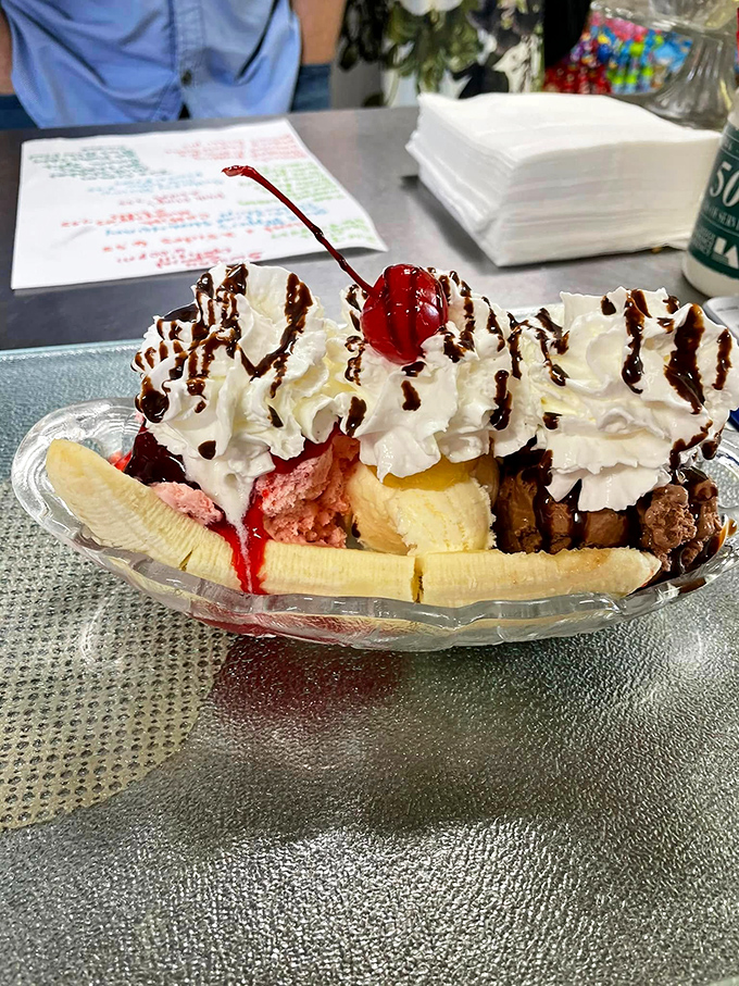 This banana split isn't just dessert—it's a celebration with whipped cream fireworks, chocolate drizzle confetti, and a cherry on top for good measure.