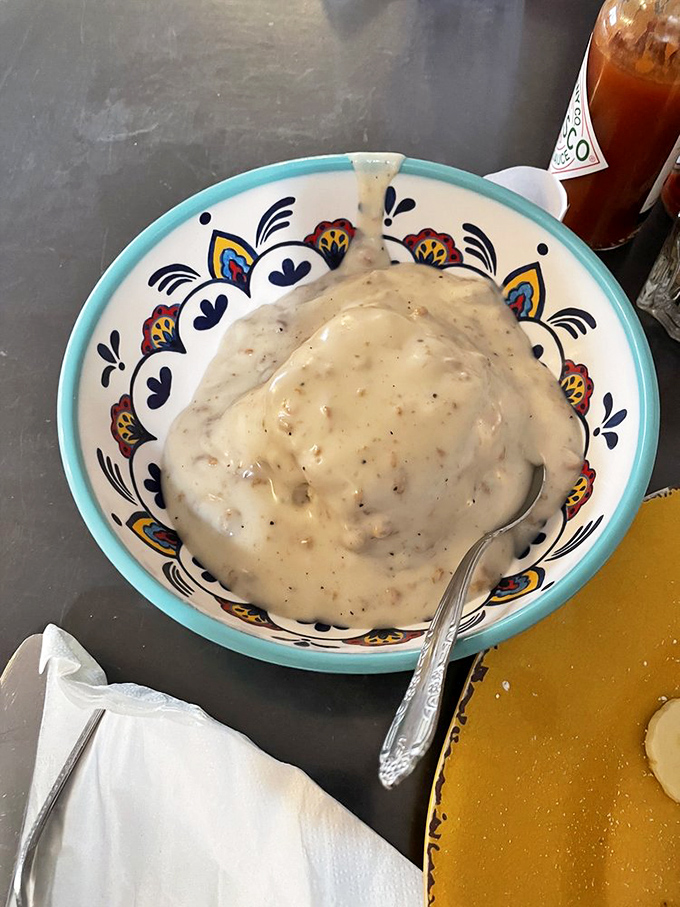 Sausage gravy that could make a vegetarian question their life choices, served in a bowl that adds instant charm.