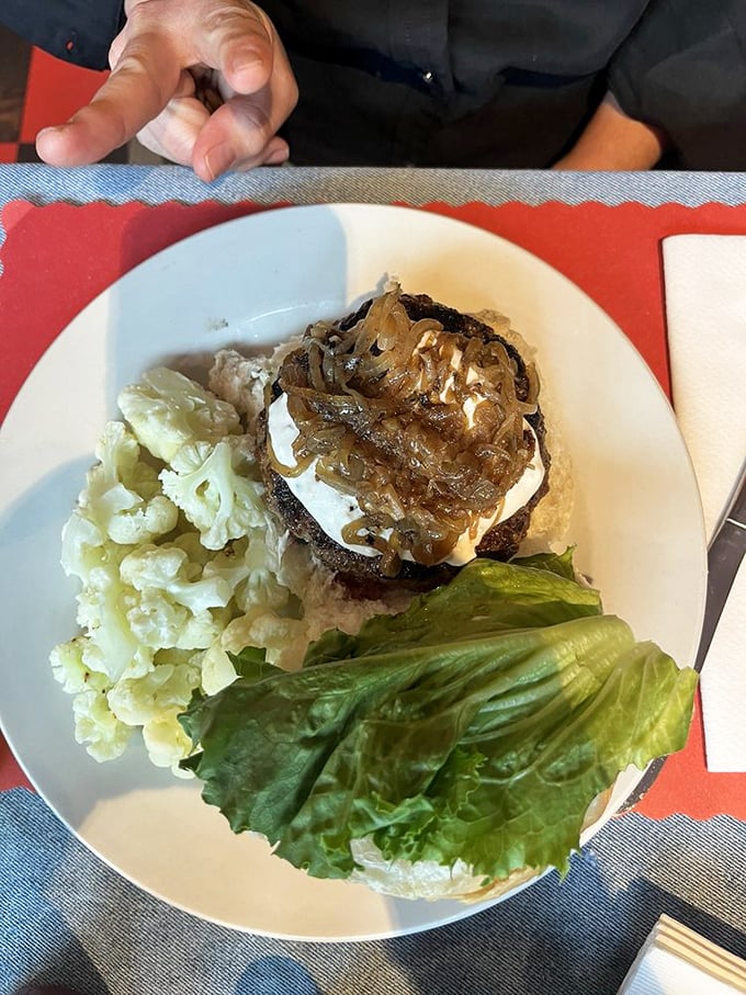 A burger topped with bleu cheese and grilled onions isn't just food—it's a flavor explosion that makes your taste buds stand up and applaud.