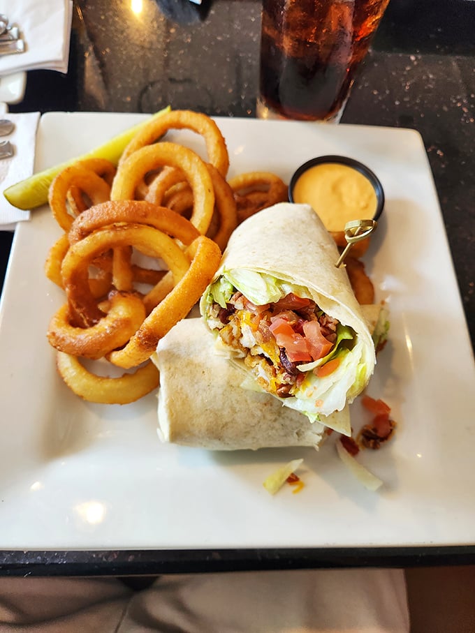 The breakfast wrap—proof that sometimes the best morning meals come in hand-held packages, with onion rings playing a supporting role.