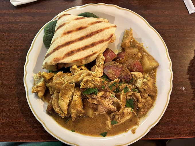 Their British curry—tender chicken in aromatic sauce with grilled naan—proves that Indiana understands global comfort food. A spice journey without the jetlag.