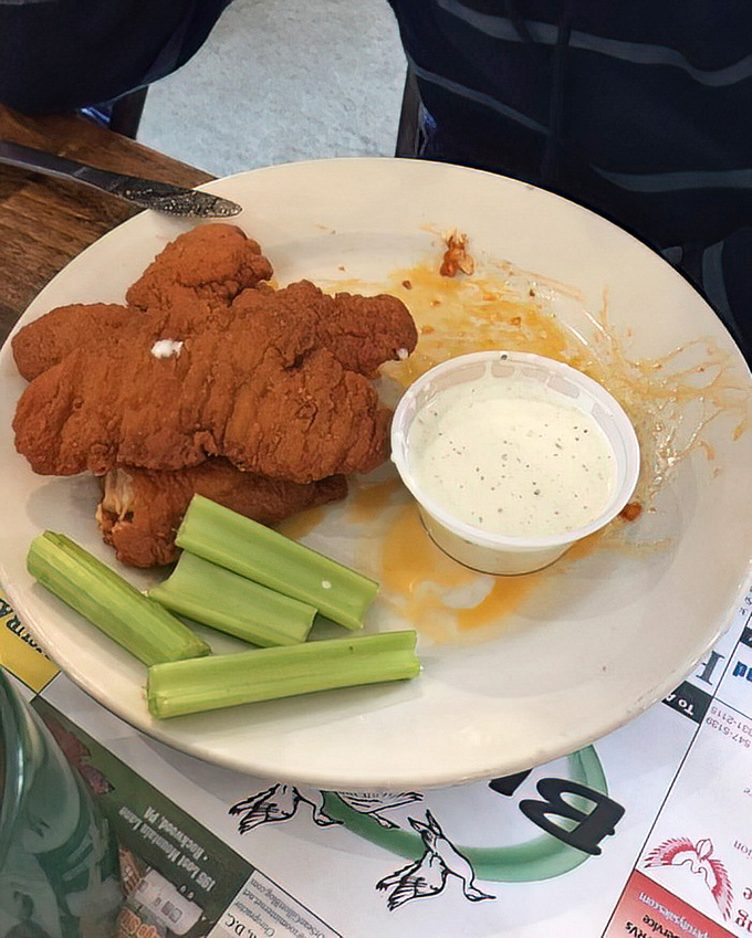 Buffalo chicken fingers that don't need a sports bar setting to shine—crispy, saucy, and ready for their blue cheese bath.