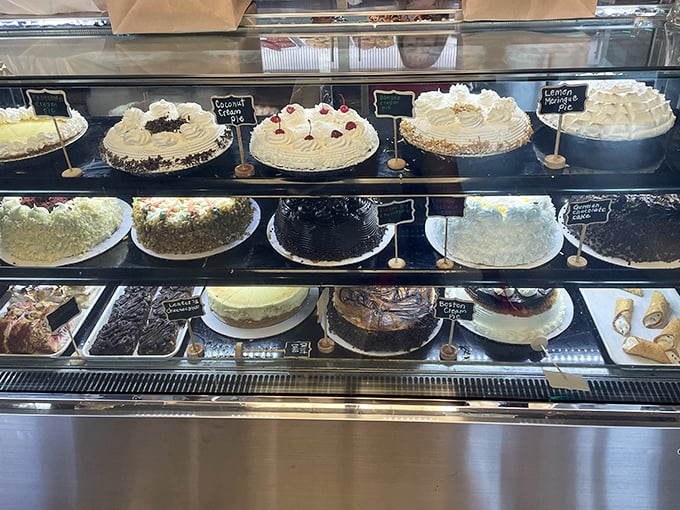 The dessert case—where willpower goes to die. These homemade cakes stand ready to transform "I shouldn't" into "I'll take a slice to go."