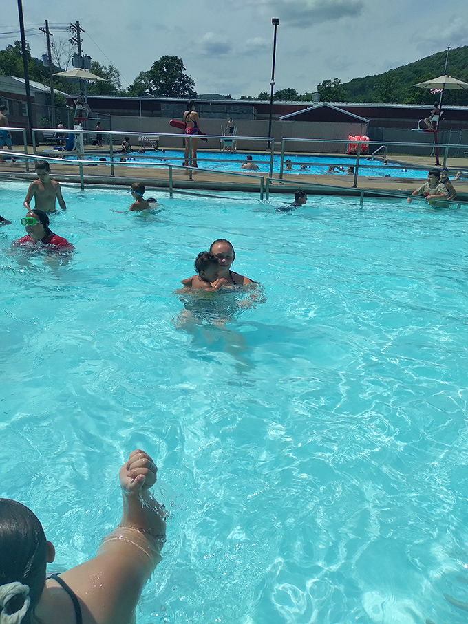Summer at the community pool – where splashing, laughing, and the occasional "Marco Polo" create the soundtrack of childhood memories.