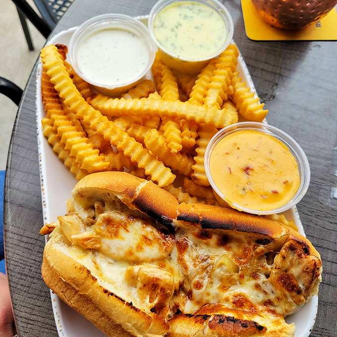 The sandwich that launched a thousand napkins. Those fries aren't just sides—they're dipping vehicles for that trio of sauces.