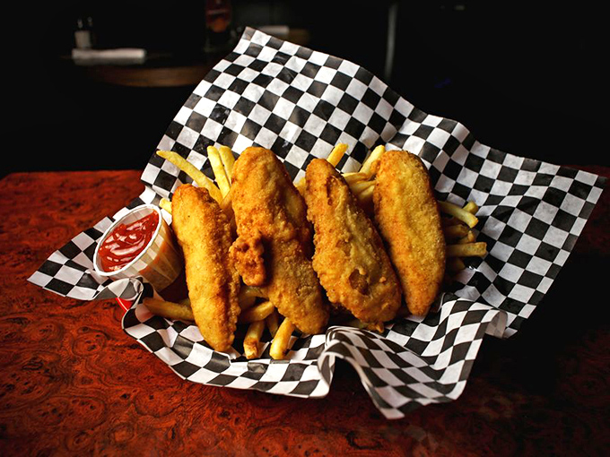 Golden-battered chicken tenders nestled beside crispy fries—comfort food that speaks the universal language of "everything's going to be okay."