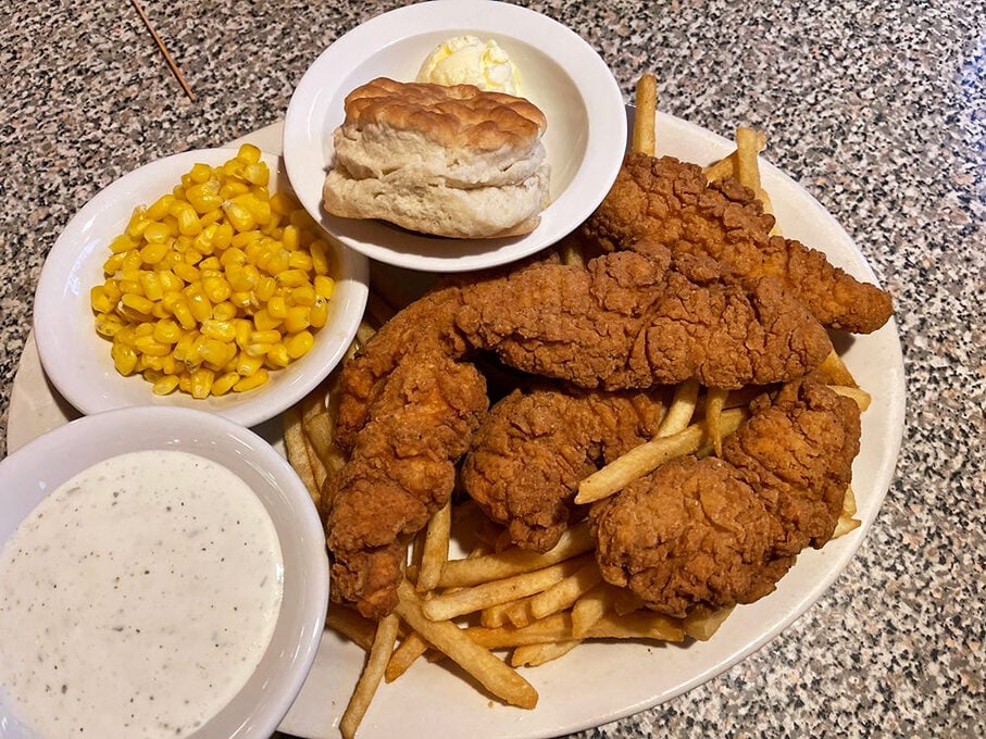 Golden fried chicken tenders with all the fixings - comfort food that would make your grandmother proud.