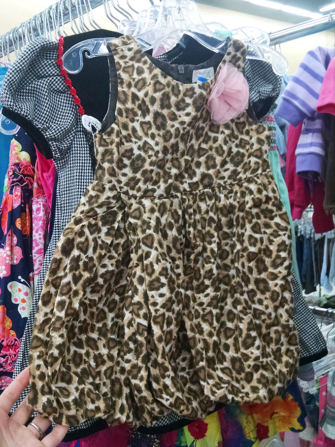 One shopper's outgrown leopard print dress becomes another child's dress-up treasure – the circle of thrift continues.