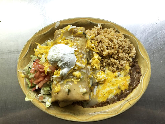 The chimichanga—Arizona's gift to Mexican cuisine—a golden-fried burrito topped with cheese, sour cream, and enough deliciousness to make you forget about tomorrow's diet.