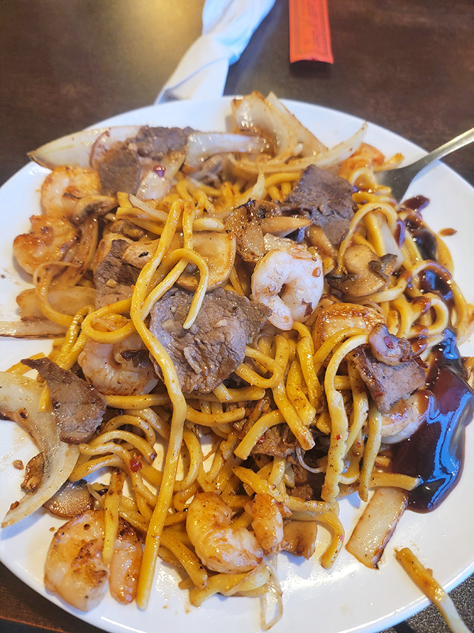 This hibachi-style noodle dish is a beautiful tangle of contrasts—chewy noodles, tender beef, plump shrimp, and crisp vegetables in harmonious coexistence