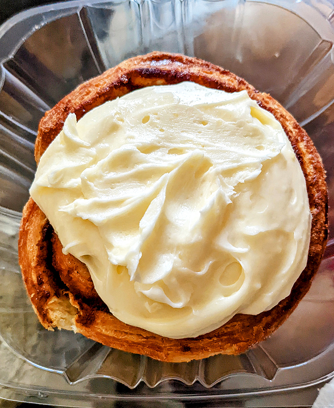 This cinnamon roll topped with cream cheese frosting isn't just dessert for breakfast—it's permission to start your day with joy on a plate.