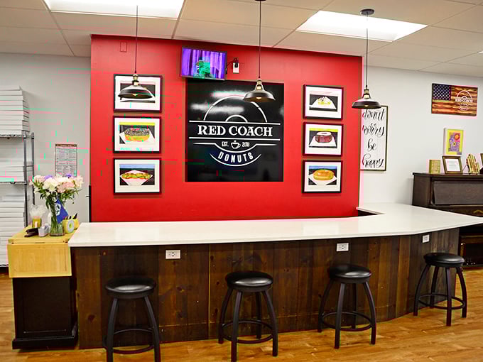 The red accent wall perfectly frames the Red Coach logo – a splash of color as bold as the flavors in their signature treats.