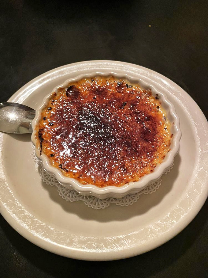 Crème brûlée with that perfect glass-like sugar crust – the sound of your spoon cracking through is half the pleasure.