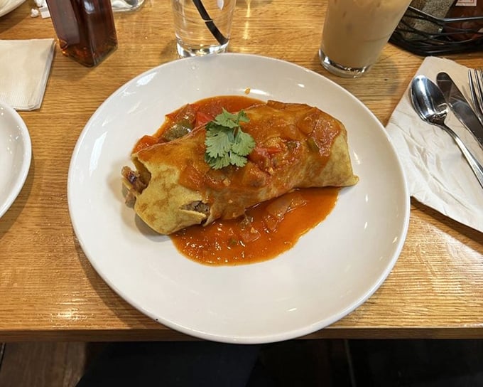 This isn't your standard breakfast burrito—it's a morning masterpiece wrapped in a tortilla, with sauce that demands to be savored.