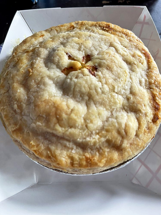 A proper British pie with a golden dome of pastry—beneath lies a world of savory filling just waiting to be discovered.