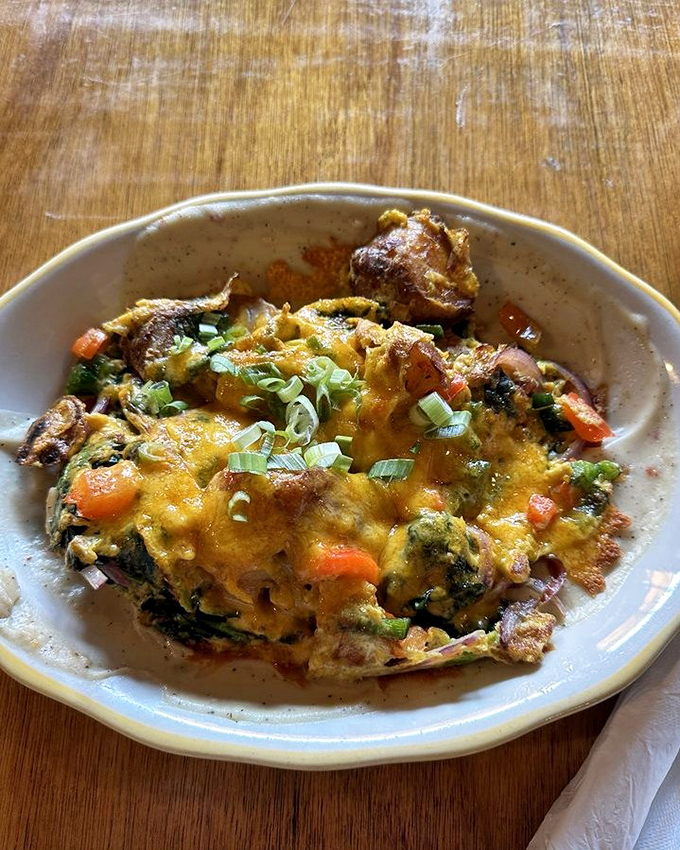 Dad's Hobo Hash isn't just breakfast—it's a colorful skillet expedition where eggs, vegetables, and cheese create a morning masterpiece worth exploring.