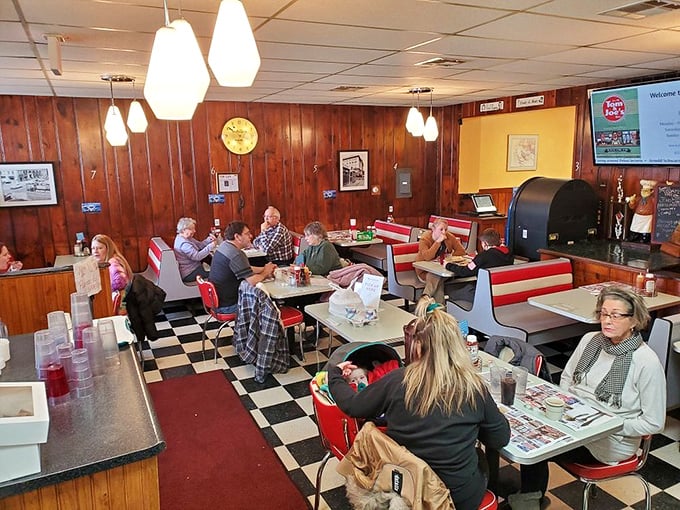 The true measure of a great diner isn't the food—it's the community that gathers there. These tables have heard more local news than any newspaper.