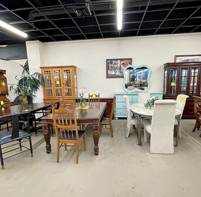 Dining sets arranged like a showroom for the indecisive—traditional oak sits beside contemporary glass, waiting for someone to take them home.