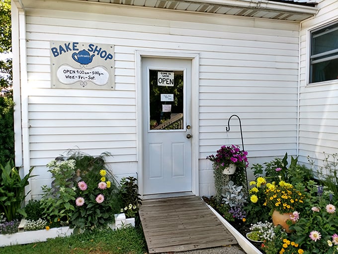 The entrance might be humble, but it's framed by flowers and possibility—each person who crosses this threshold leaves happier than they arrived.