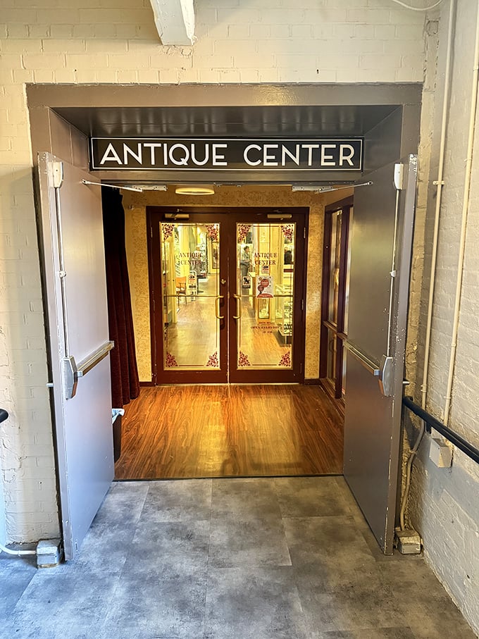 The unassuming entrance to the Antique Center beckons with promise—beyond these doors lie thousands of objects waiting for their next chapter.