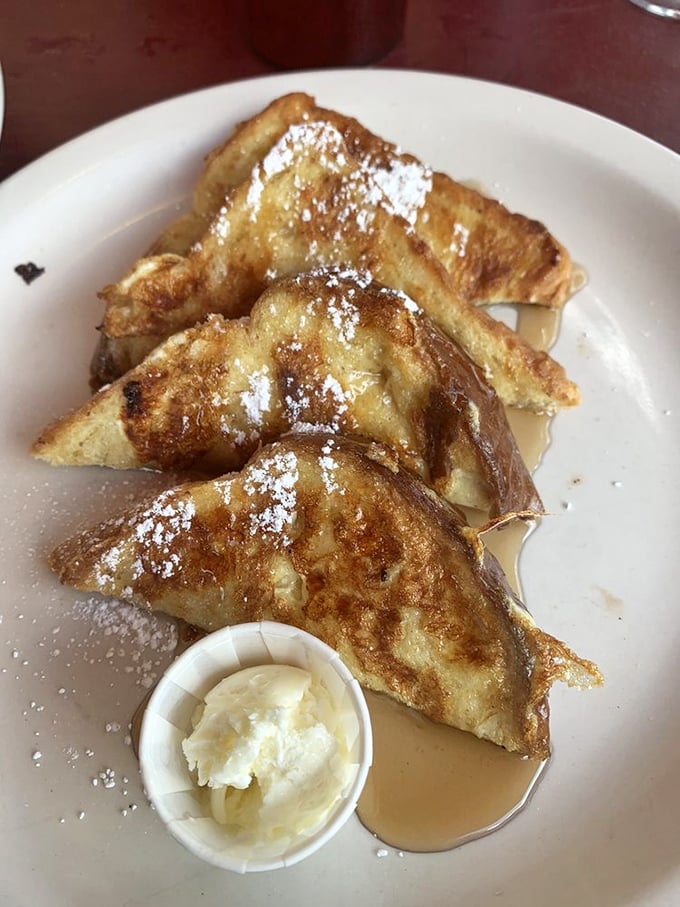 French toast that makes bread feel special again. That dusting of powdered sugar isn't decoration—it's the final blessing on a breakfast masterpiece.