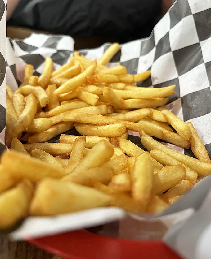 French fries that understand their supporting role – crispy, golden, and ready to soak up any sauce that might have escaped the chicken.