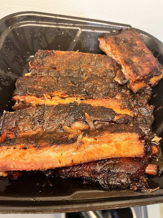 These ribs aren't just falling off the bone—they're practically jumping into your mouth with a perfect bark that whispers, "We were worth the drive."