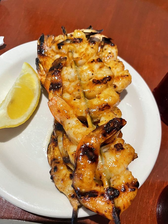 Grilled shrimp skewers charred to perfection with a bright lemon wedge. Simple, elegant, and proof that sometimes the best dishes are the least complicated.