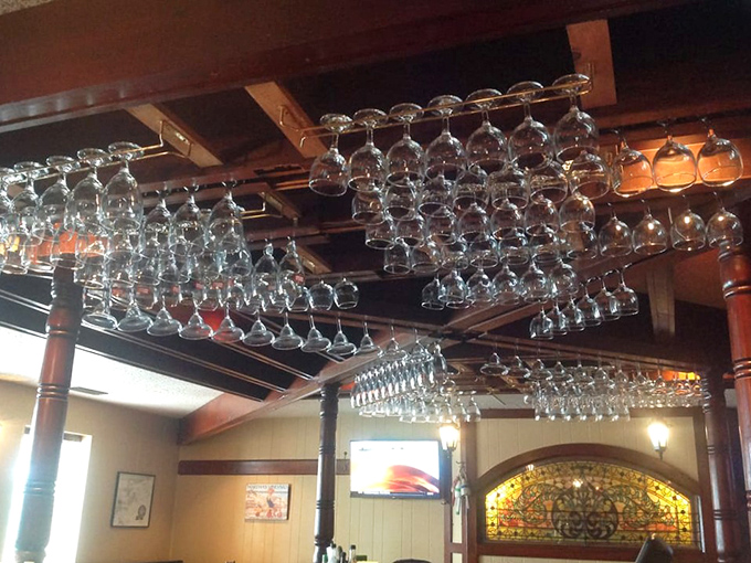These suspended wine glasses aren't just practical storage—they're crystal chandeliers waiting to participate in your celebration of exceptional seafood.