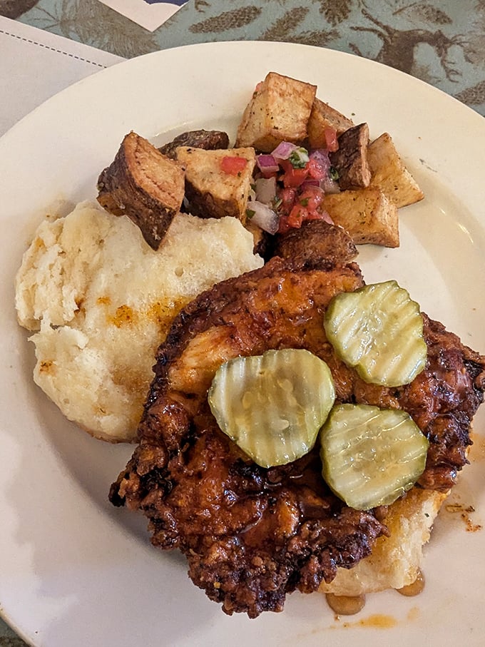 Nashville's hot chicken makes a breakfast appearance, complete with pickle coins that cut through the heat like cool jazz on a summer night.