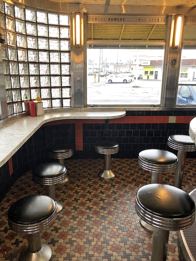 Window seats offer prime people-watching with your meal—though most eyes stay fixed on the hypnotic dance of spatulas on the griddle.