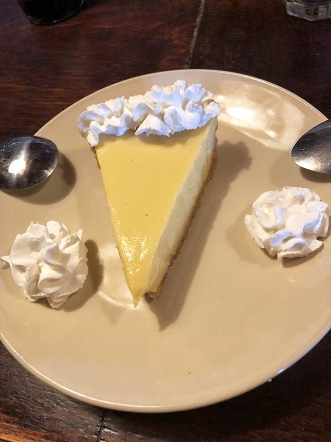 Key lime pie that strikes the perfect balance between tart and sweet—the dollops of whipped cream standing by like loyal supporters of citrus perfection.