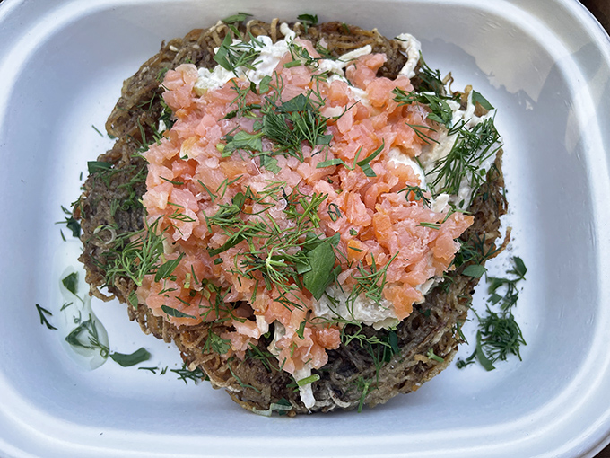 Lox tartare atop a potato pancake throne—breakfast elevated to an art form. This dish doesn't just start your day; it launches it into orbit.