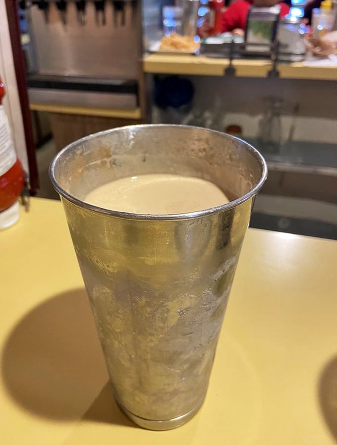 The classic malt in its traditional metal mixing cup. Cold, creamy counterpoint to all that warm, buttery goodness—balance in all things.