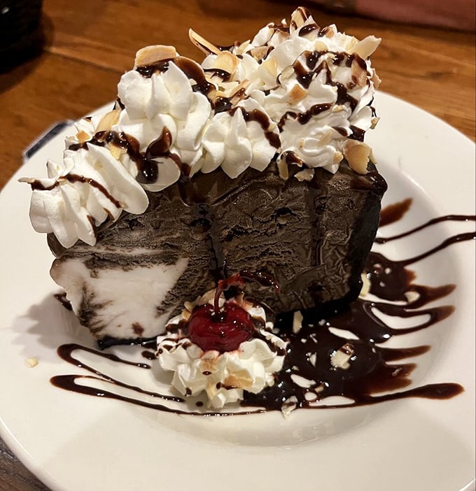 This isn't just dessert – it's a chocolate mud pie monument to the idea that you should always save room for something sweet.
