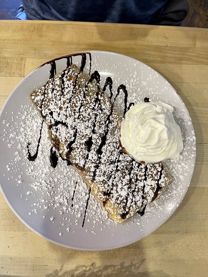Dessert for breakfast? Absolutely. This Nutella crepe with its chocolate drizzle and powdered sugar snowfall makes adulting worth it.