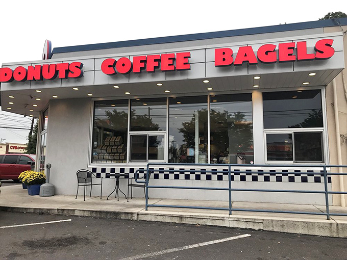 The red block letters announce life's essentials with admirable directness. DONUTS, COFFEE, BAGELS—sometimes the simplest signs point to life's greatest pleasures.