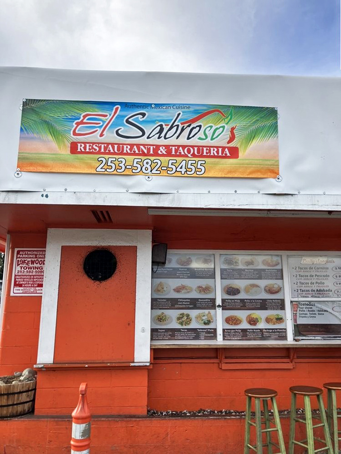 The tropical-themed sign promises "Authentic Mexican Cuisine"—a bold claim that, based on the lines of hungry customers, Taqueria El Sabroso delivers on daily.